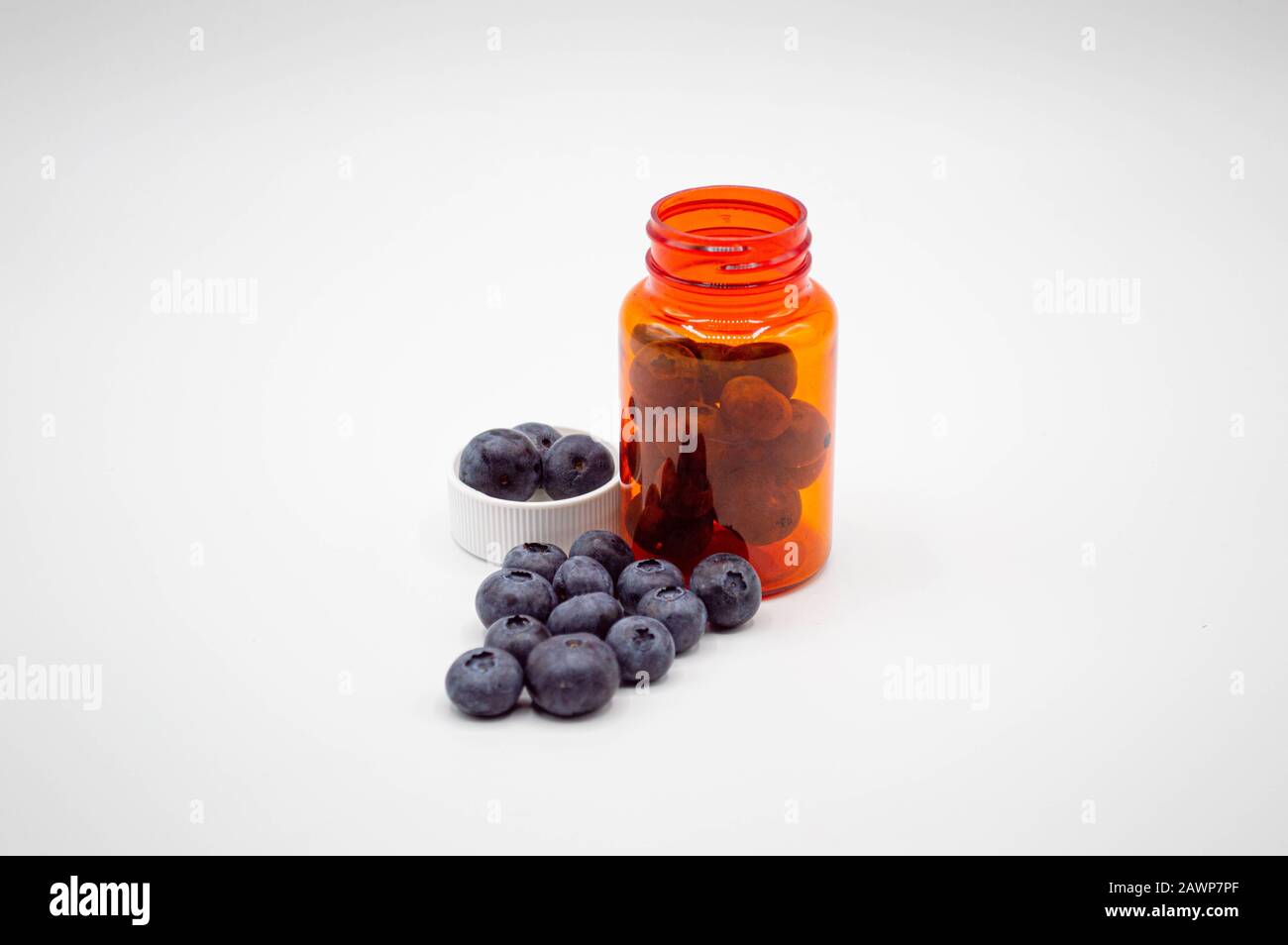 Prescription bottle with cap with fresh blueberries pouring out Stock ...