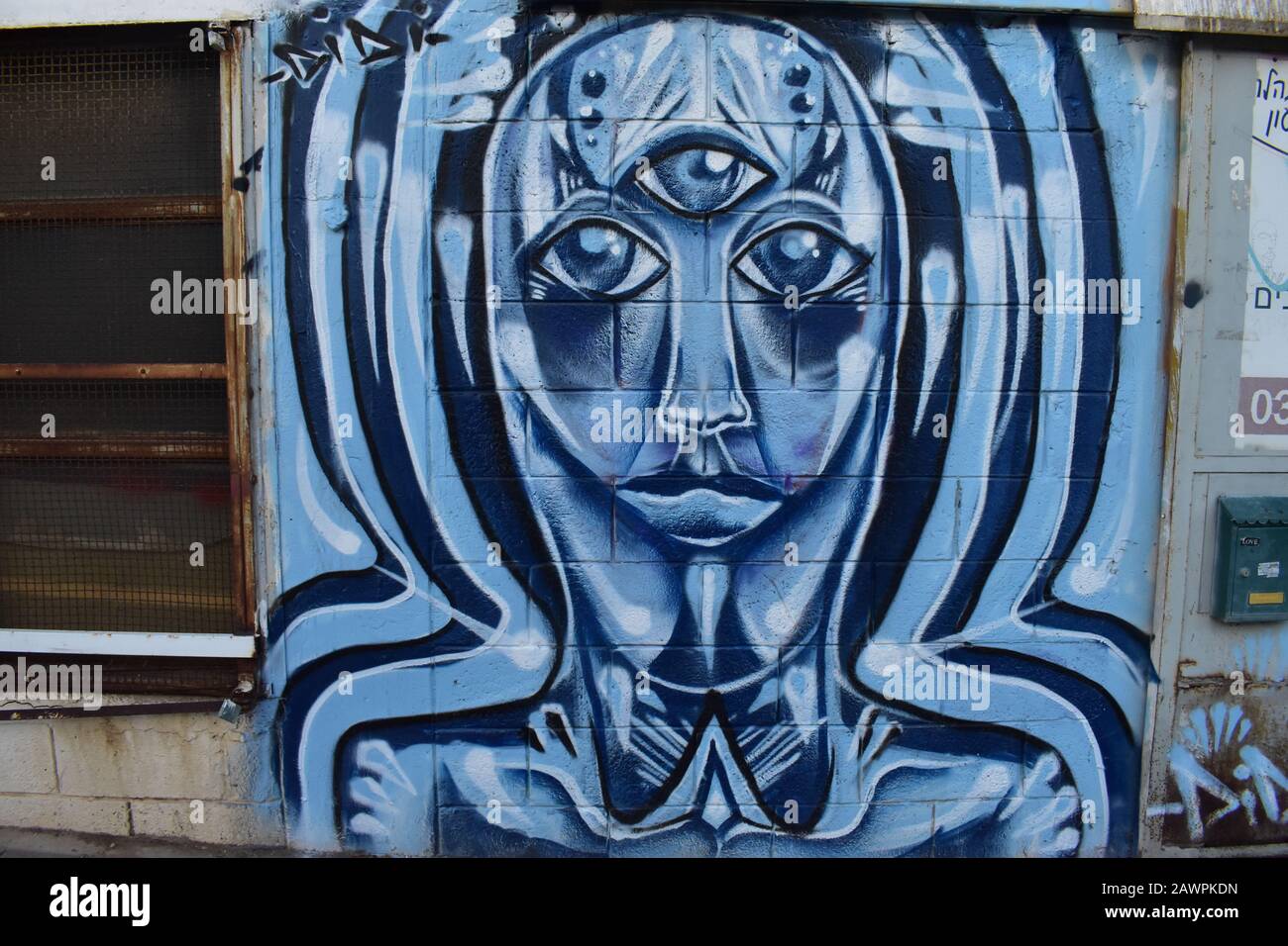 blue three eyed face Graffiti on a wall in Florentin Tel Aviv Stock ...