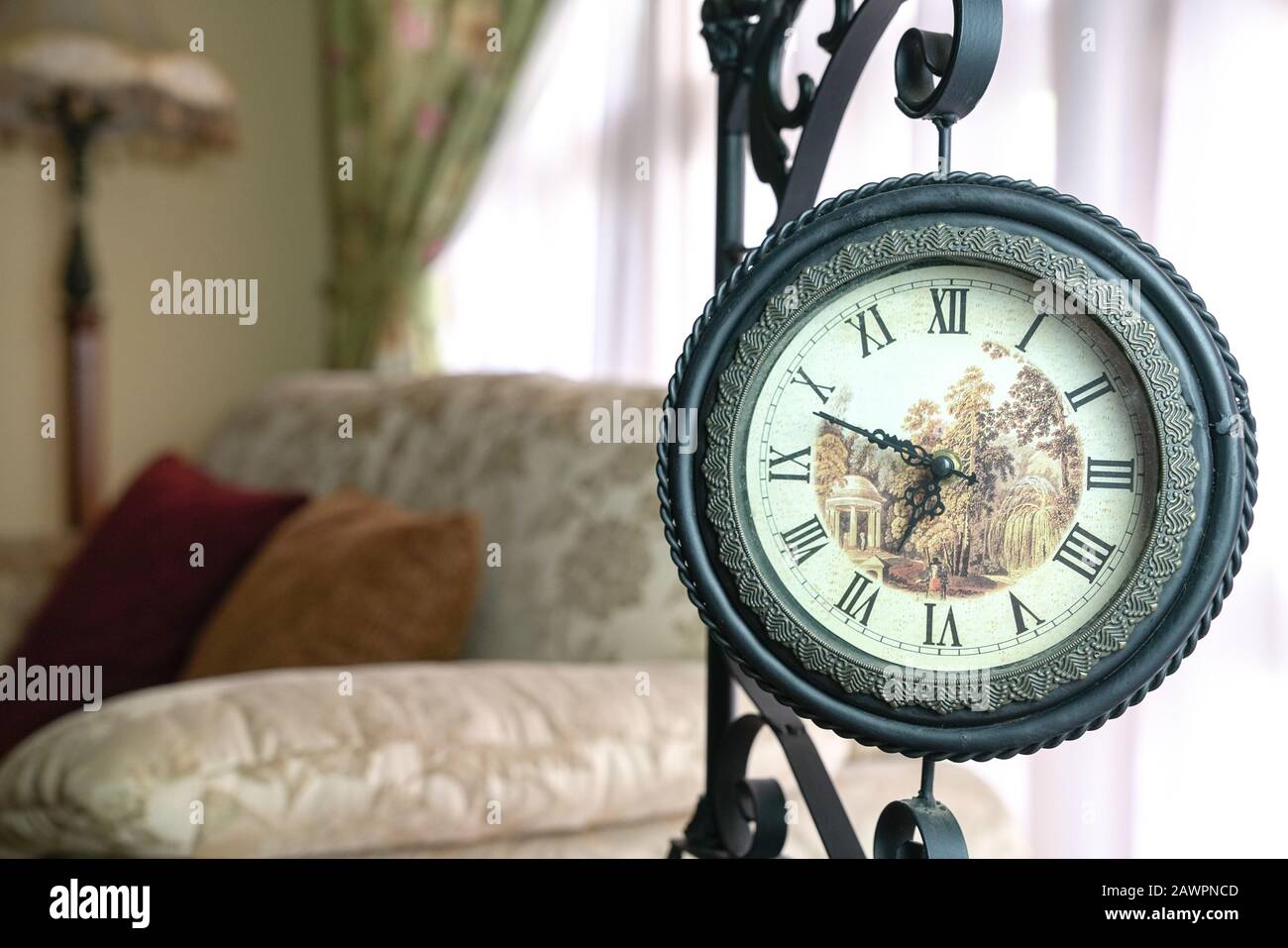 Vintage clock made of steel, inside a room. Cosy environment. Copy ...