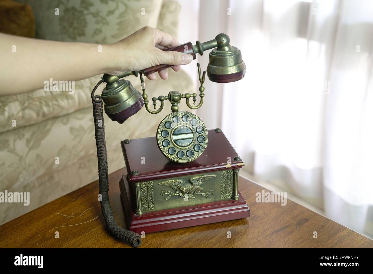 Hand picking up telephone hi-res stock photography and images - Alamy