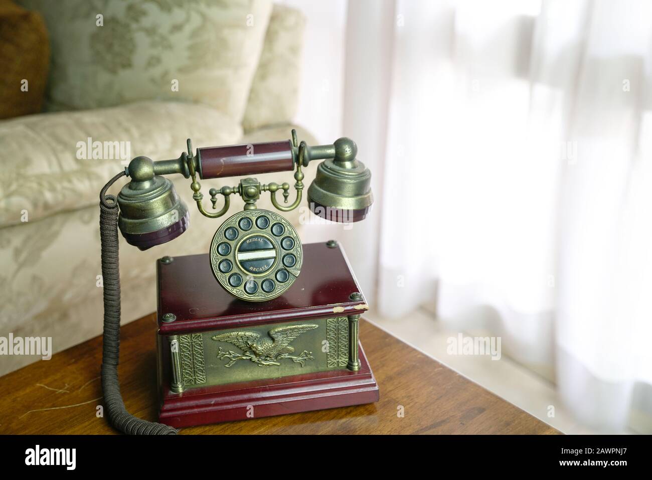 Classic vintage phone on a wooden top inside a house Stock Photo - Alamy