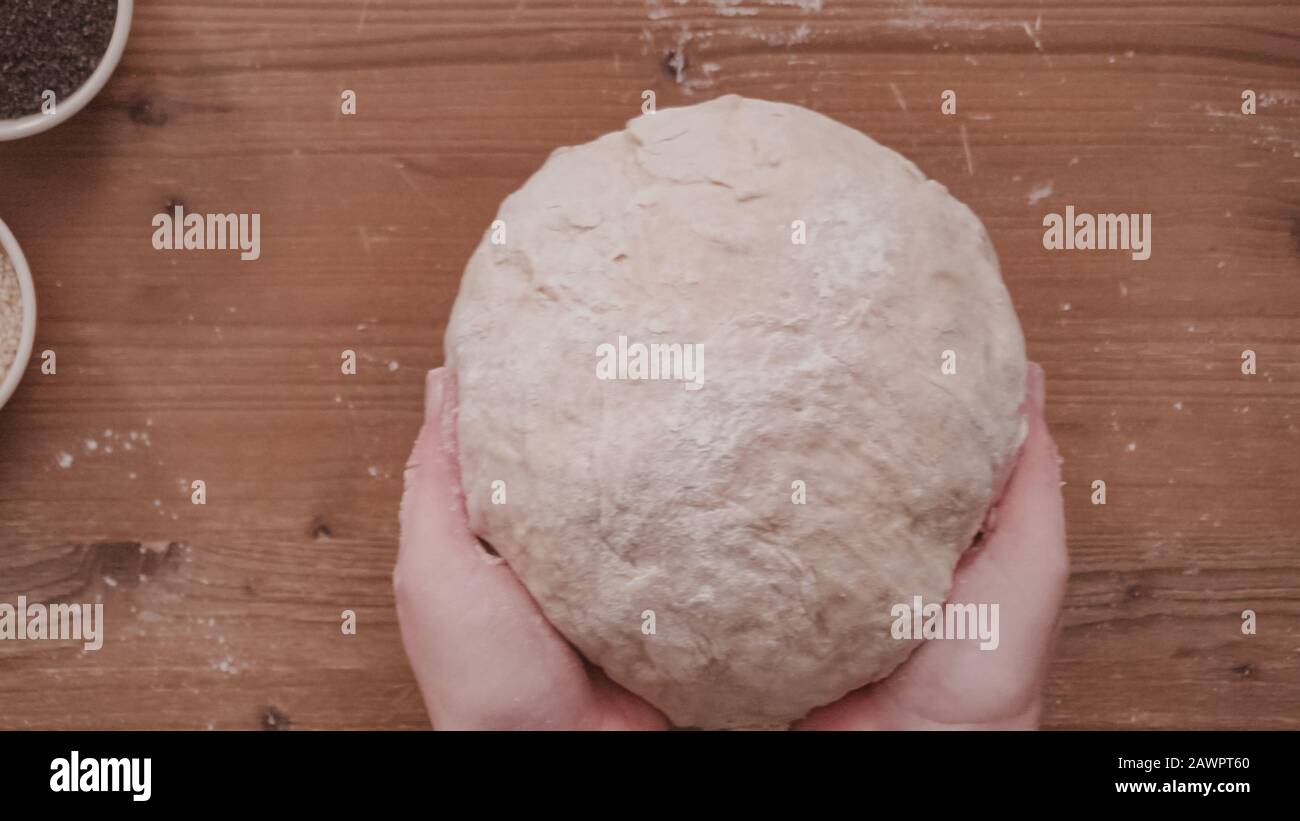 Flat lay. Step by step. Baker holding bread dough in his hands Stock ...