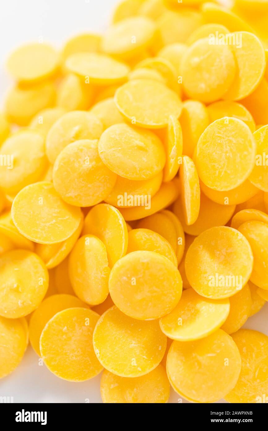 Yellow round chocolate chips for melting chocolate shapes Stock Photo ...