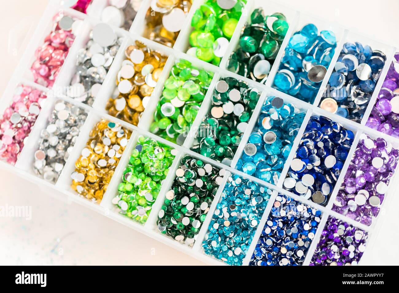 Color and size variety of rhinestones in the craft box Stock Photo - Alamy