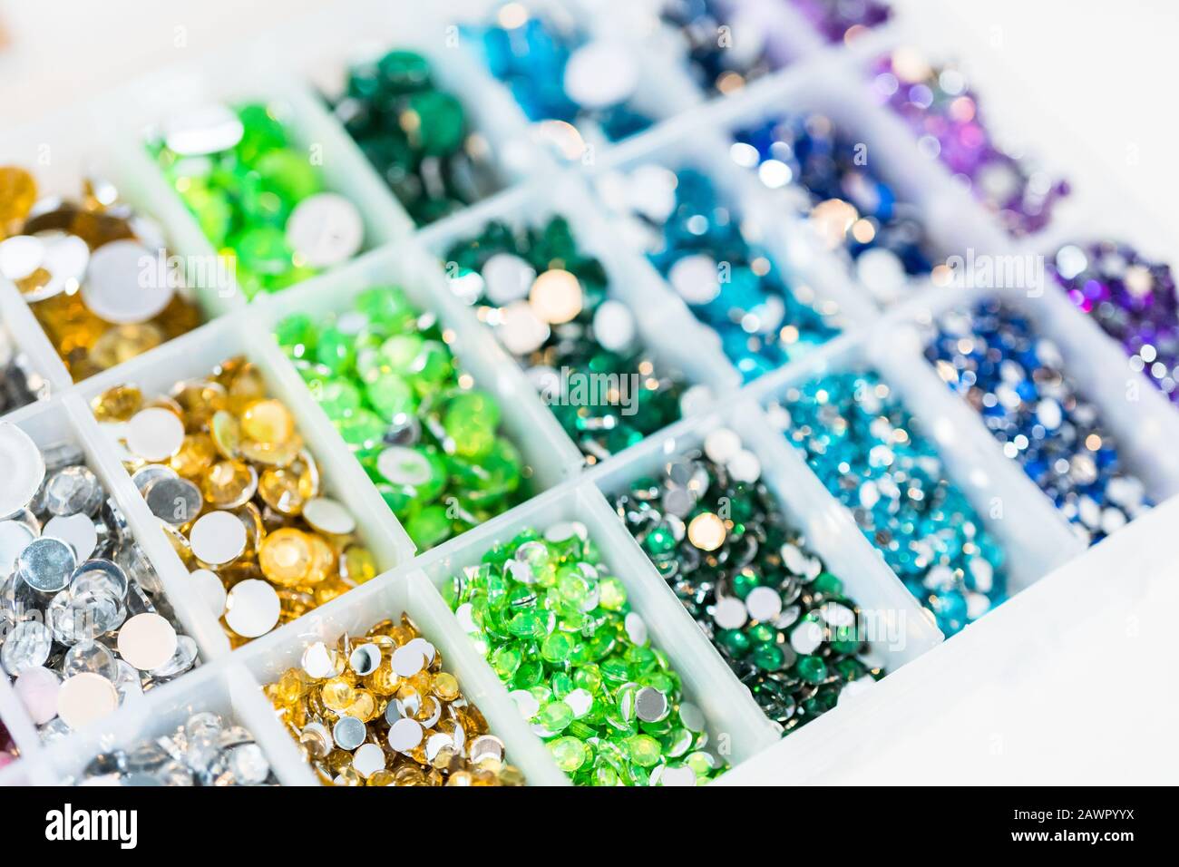 Color and size variety of rhinestones in the craft box Stock Photo - Alamy