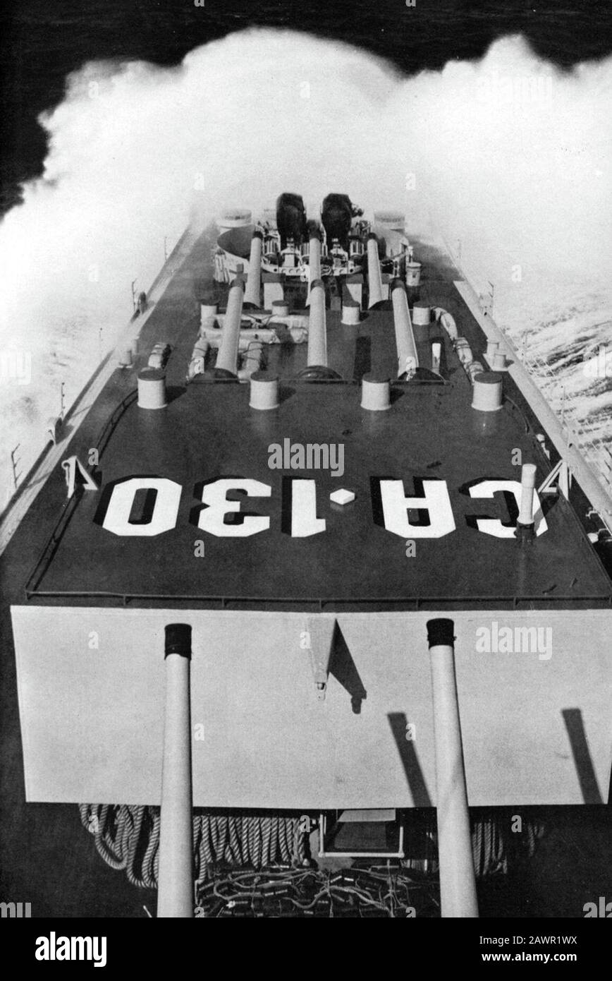 Forecastle of USS Bremerton (CA-130) in heavy seas, in 1953 Stock Photo ...