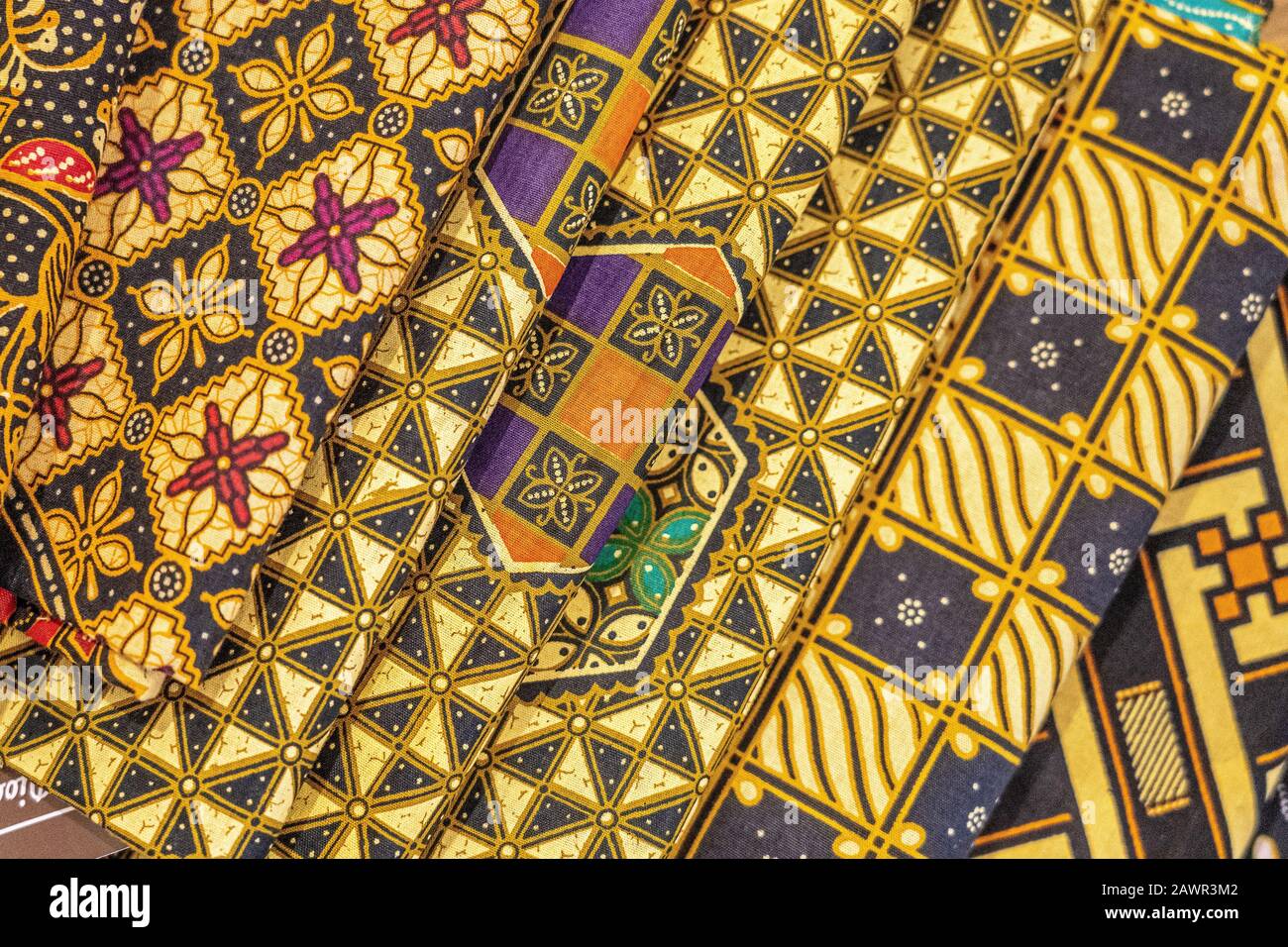 High angle closeup shot of colorful textiles with beautiful Asian ...