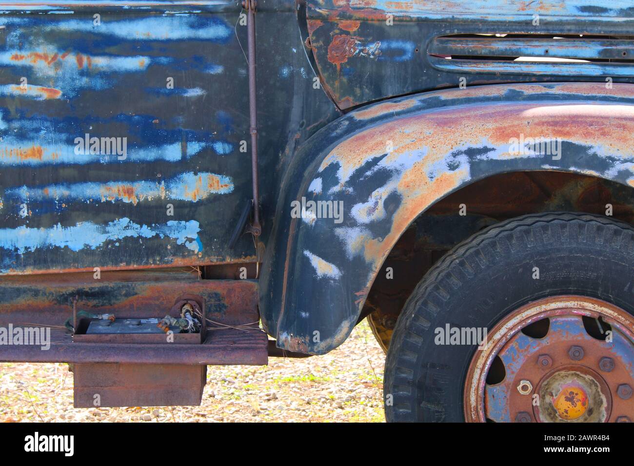 a rusted blue truck door panel and wheel Stock Photo - Alamy