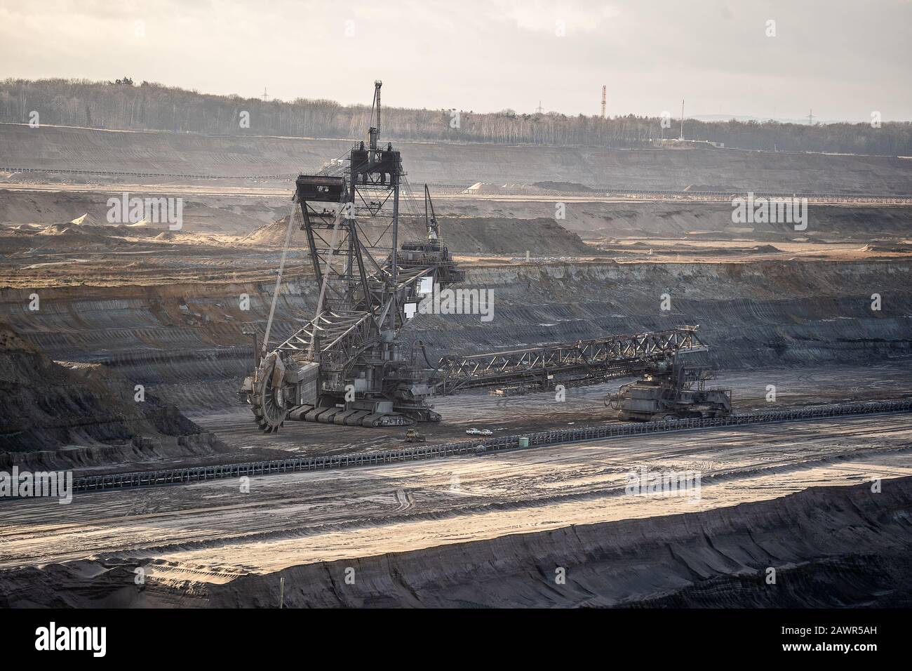 Wide shot of a crane and a metal structure in a mining site Stock Photo ...