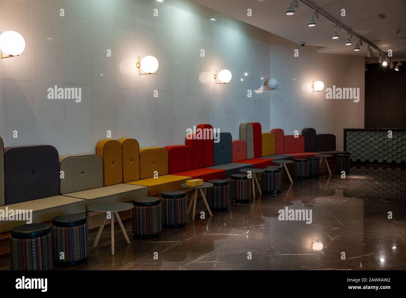 Hall with colorful seats and illuminated lamps Stock Photo - Alamy