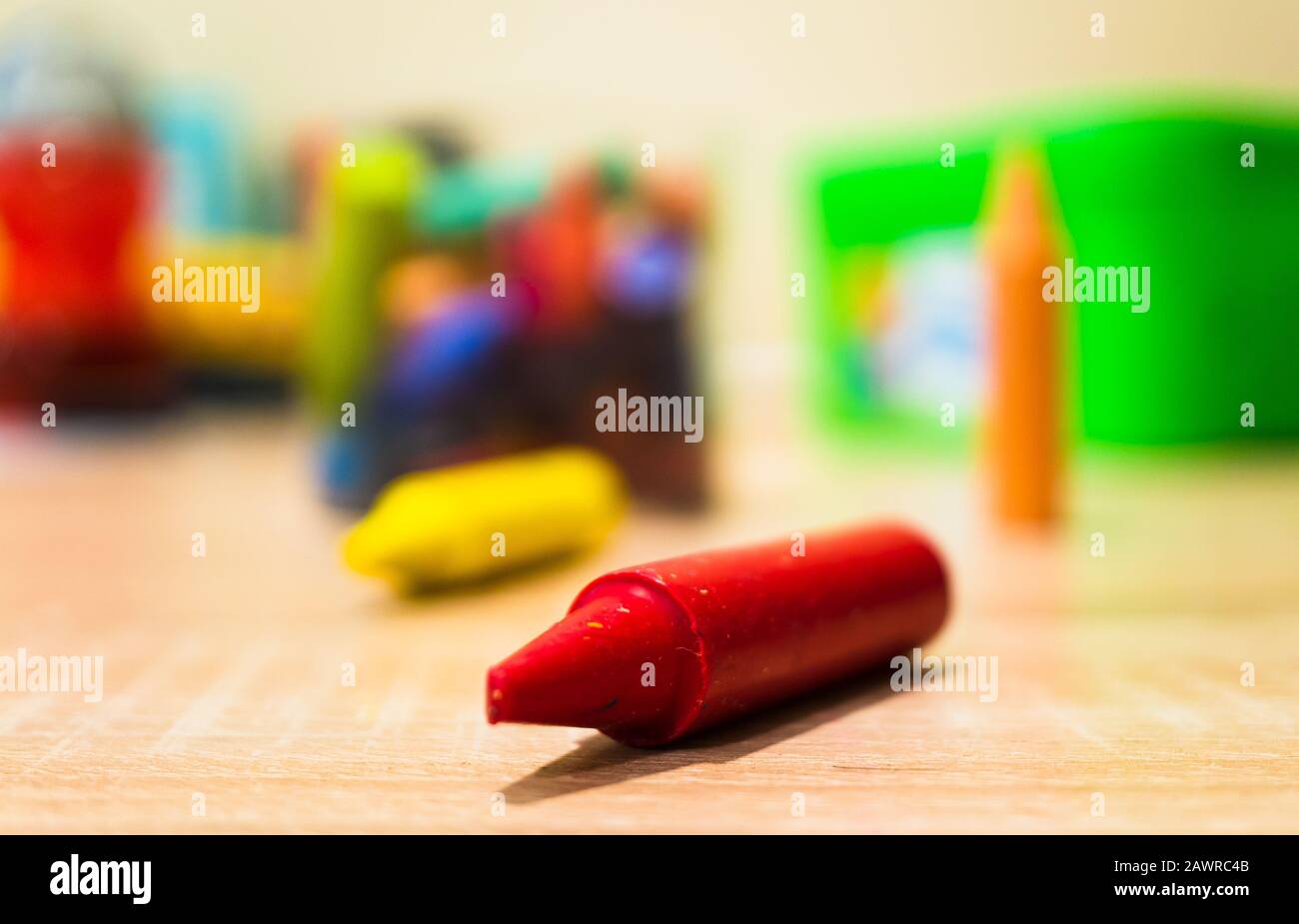 Colorful crayons in the ground of the kid's playing room Stock Photo ...