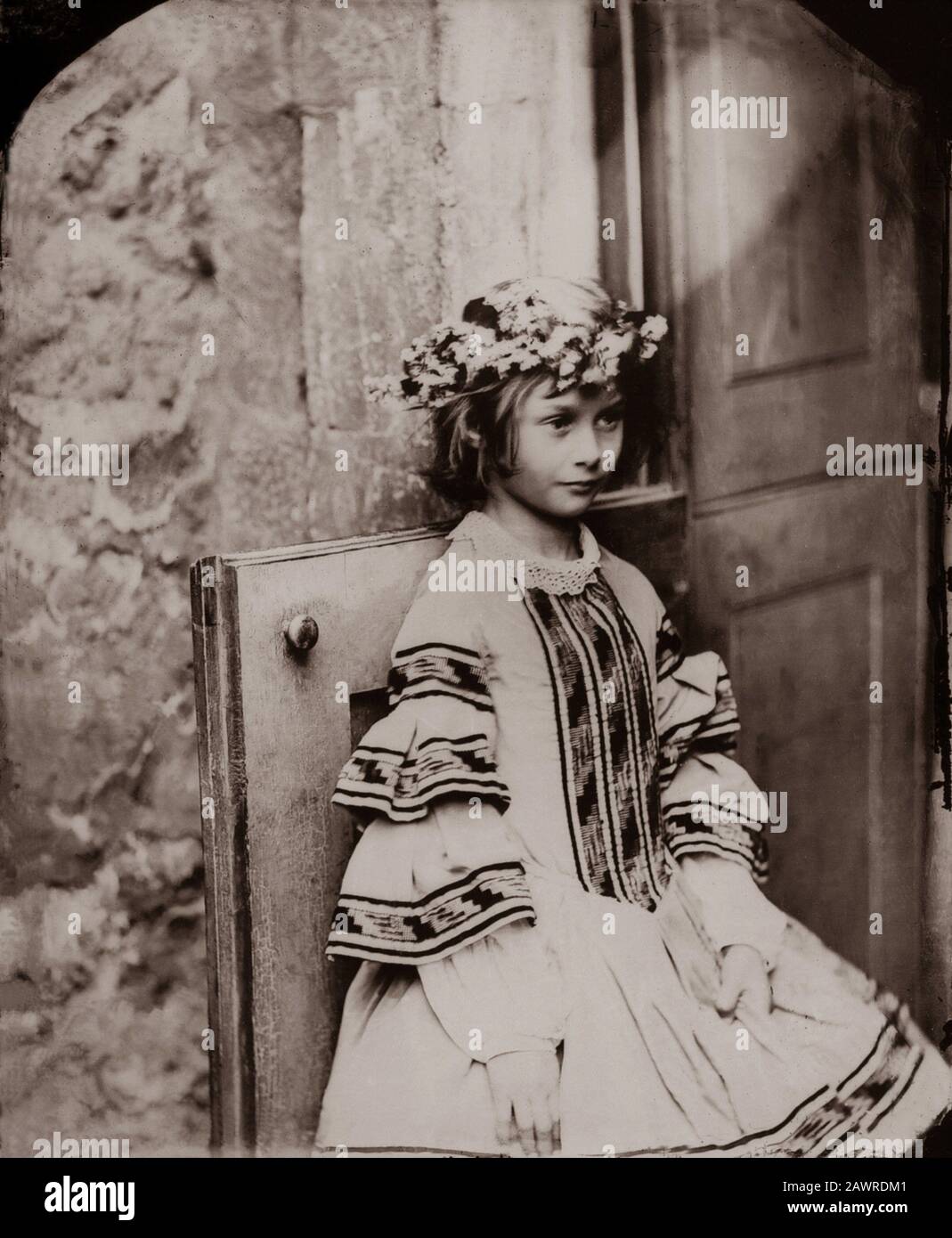 1860 , GREAT BRITAIN : Alice Liddell , wearing a garland ( the little ...