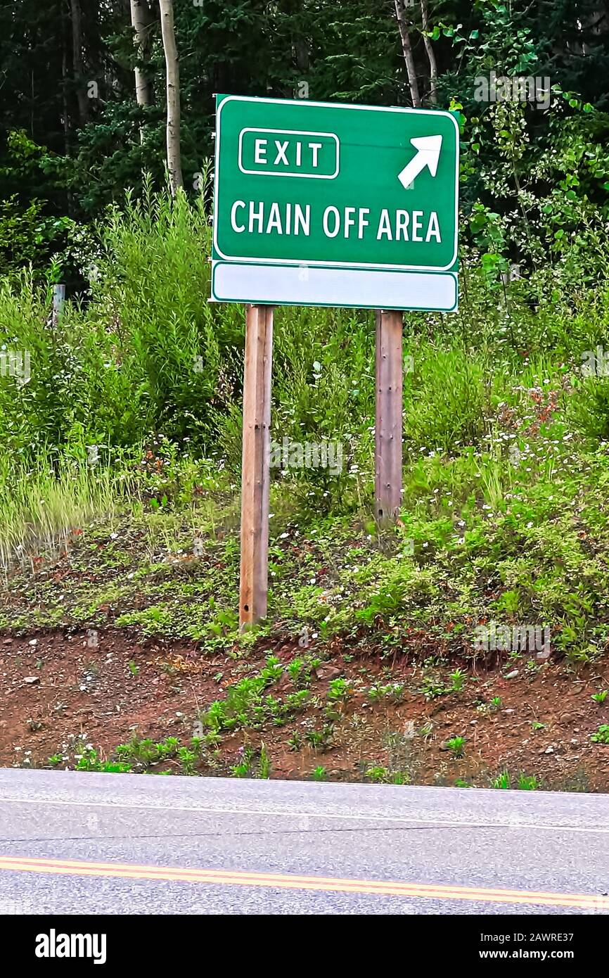 An exit chain off area sign with an arrow Stock Photo - Alamy