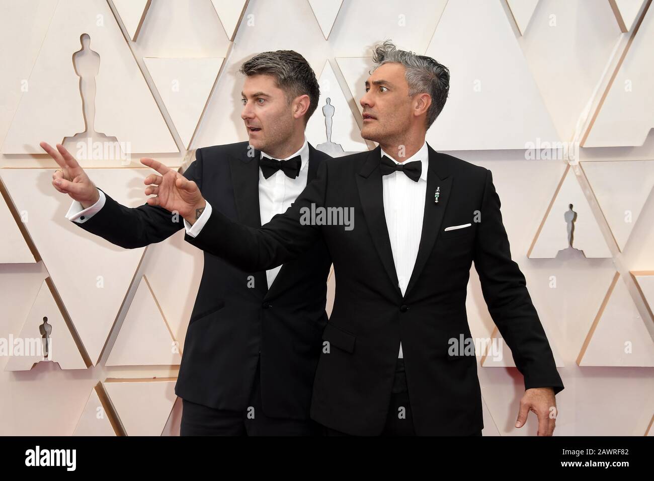 Carthew Neal and Taika Waititi walking on the red carpet at the 92nd ...