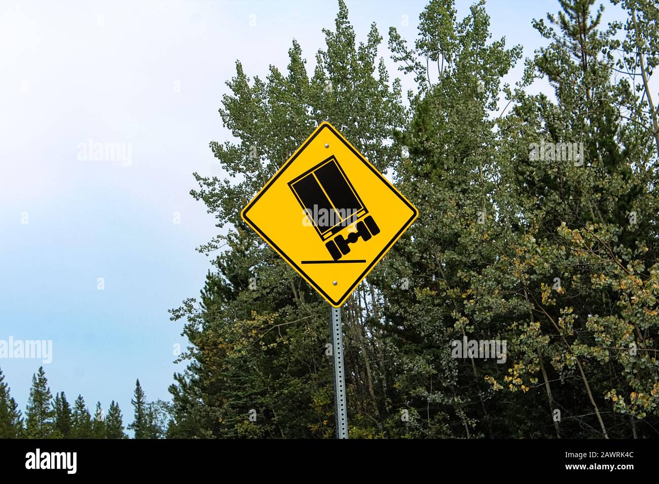 A truckers warning sign about tipping hazards Stock Photo - Alamy