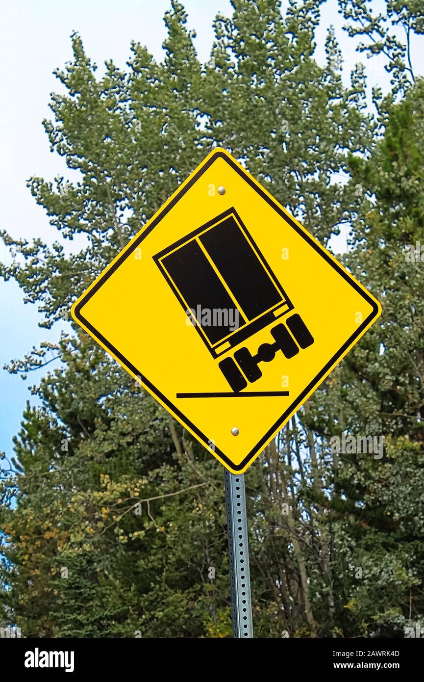 A truckers warning sign about tipping hazards Stock Photo - Alamy