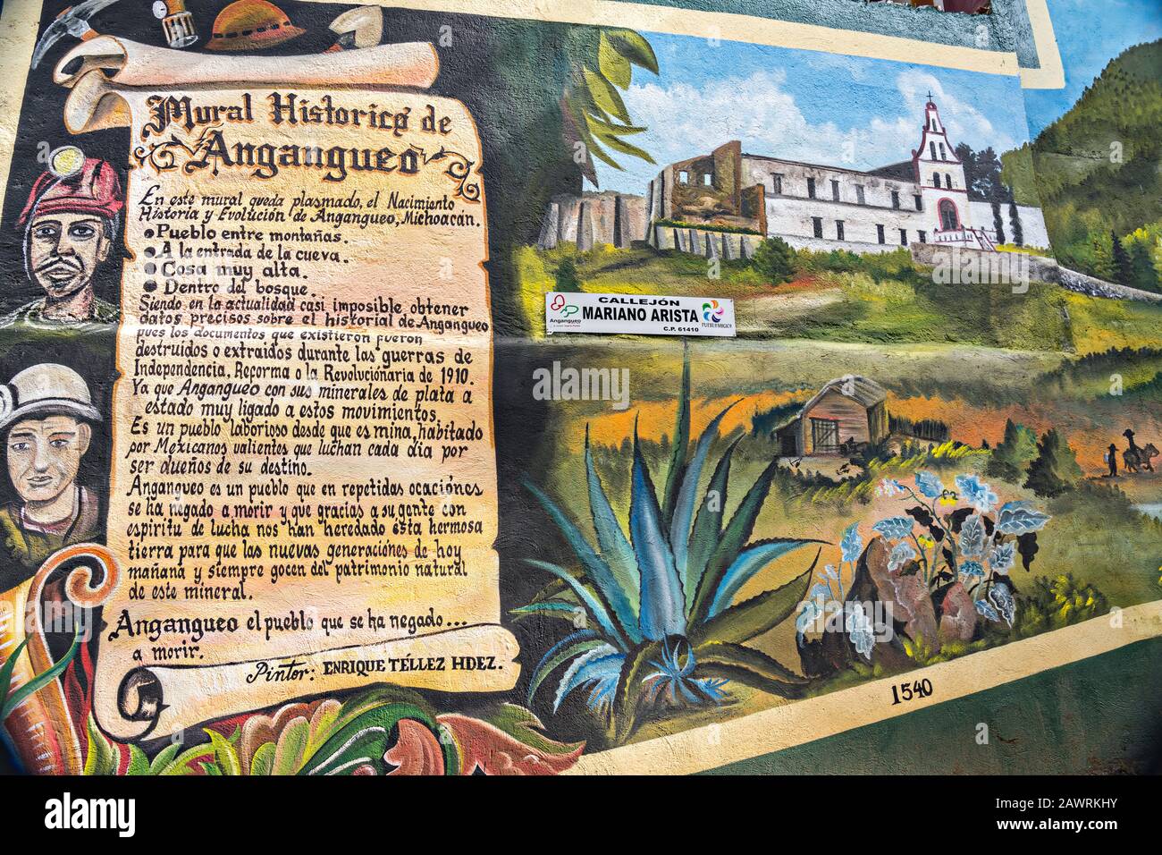A mural painted on a building celebrating the history of Angangueo ...