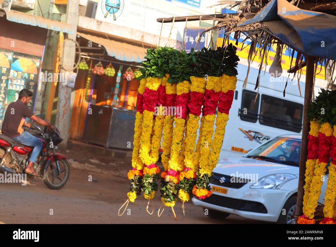Floral decorations comprising chains of yellow marigold flowers, and ...