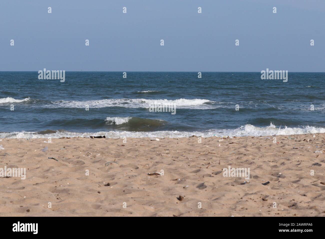 sharp image of empty beach against blue sea and clear sky in nature ...