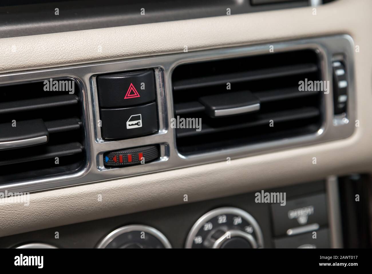 Close-up on emergency button with red triangle icon on the car ...