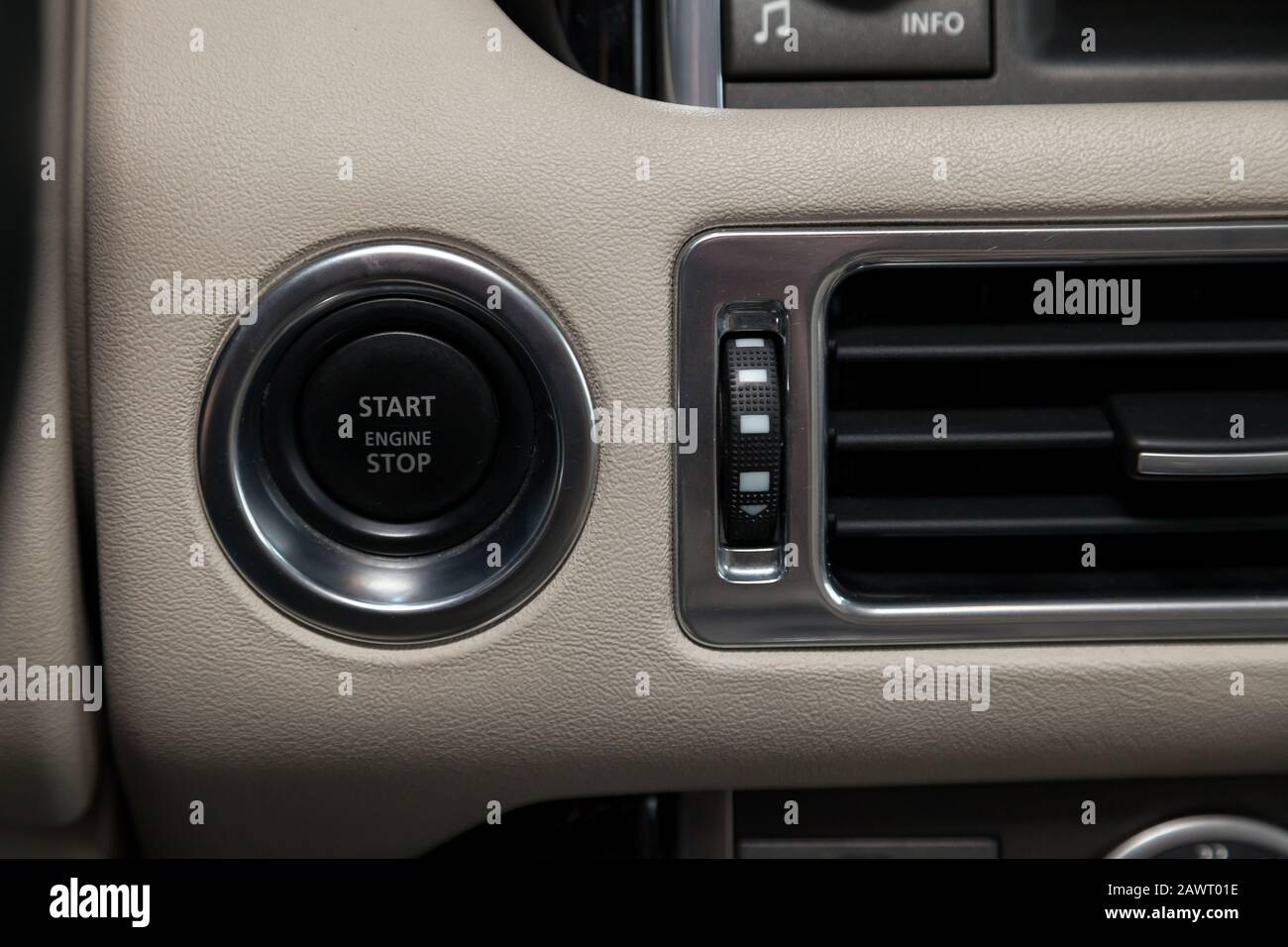Button start and turn off the ignition of the car engine close-up on ...