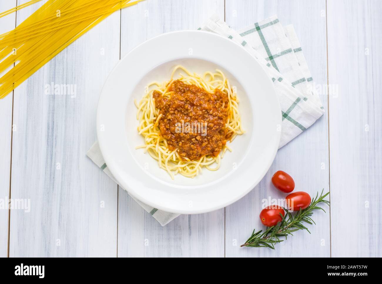 Delicious spaghetti bolognese with meat sauce with tablecloth on white ...