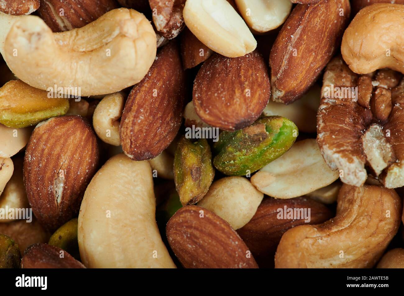 Group of dry nuts close up view. Healthy eating theme Stock Photo - Alamy
