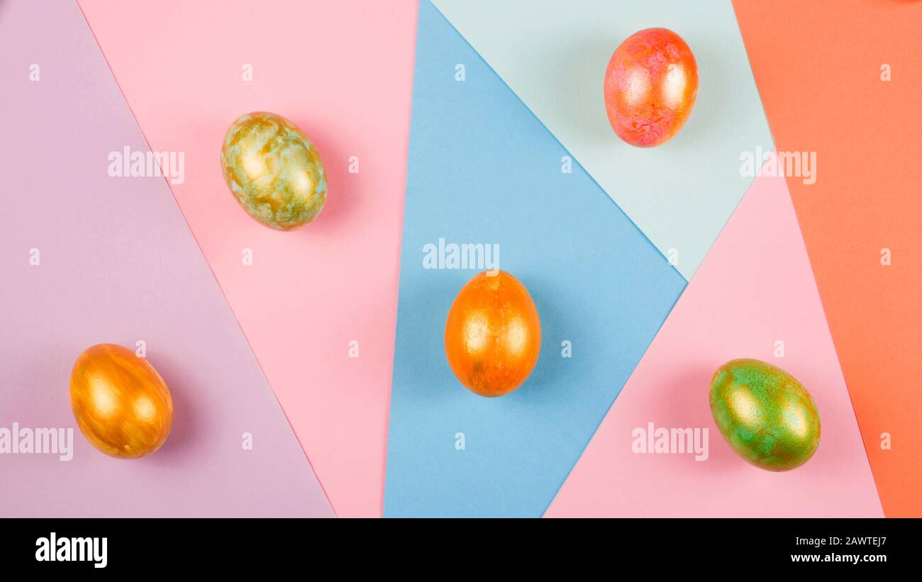 Modern minimalistic easter layout with eggs on a colorful geometric ...