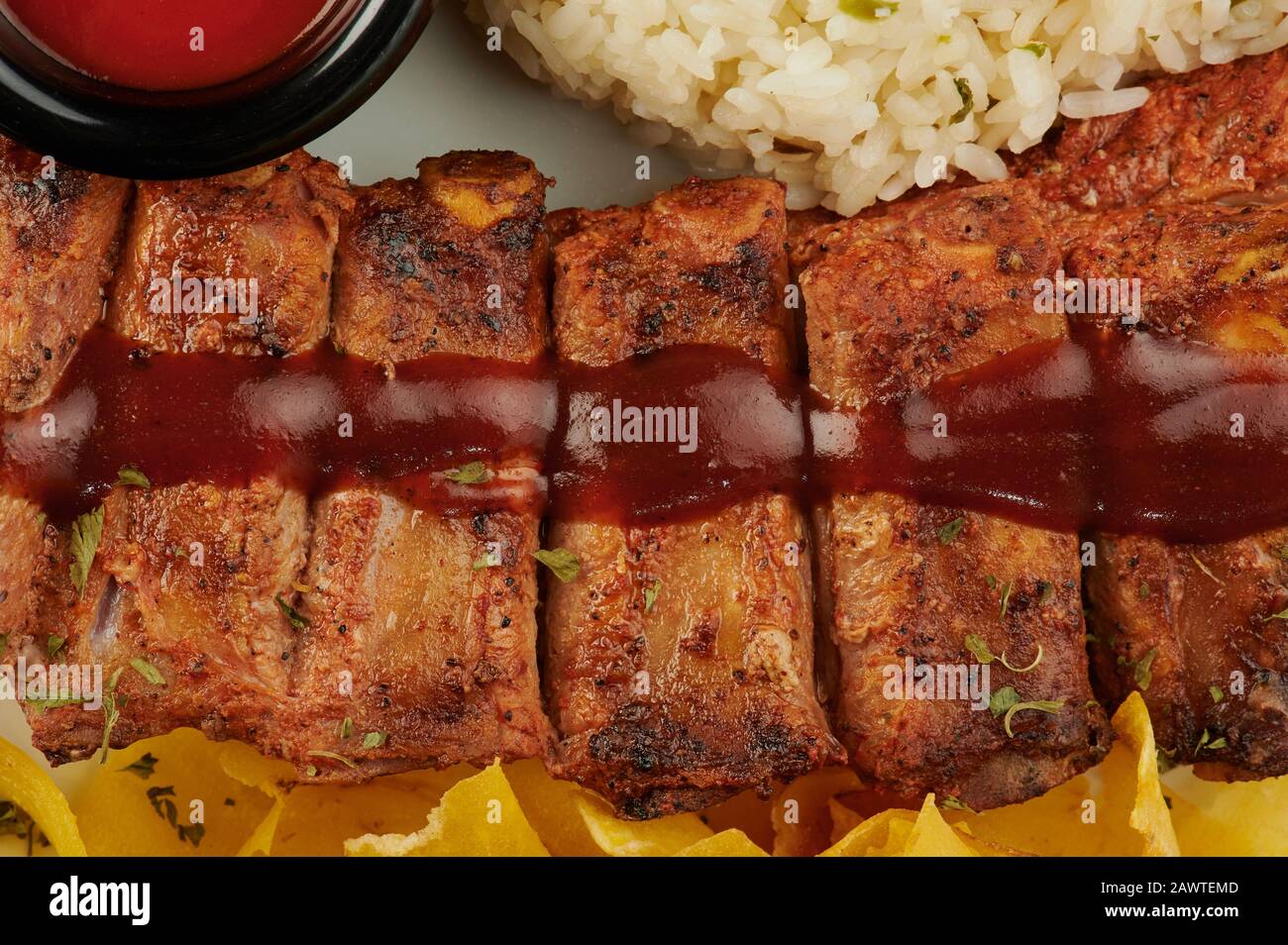 Big slice of bbq ribs with rice and tomato ketchup close up view Stock ...