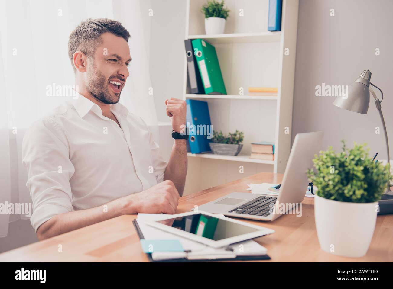 Yes! Happy businessman successfuly completed his task Stock Photo - Alamy