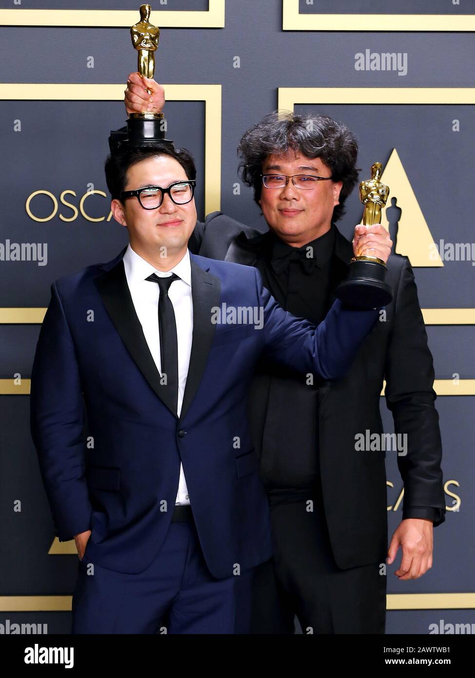 HOLLYWOOD, CA - FEBRUARY 9:Bong Joon-ho, Han Jin-won pose in the press ...