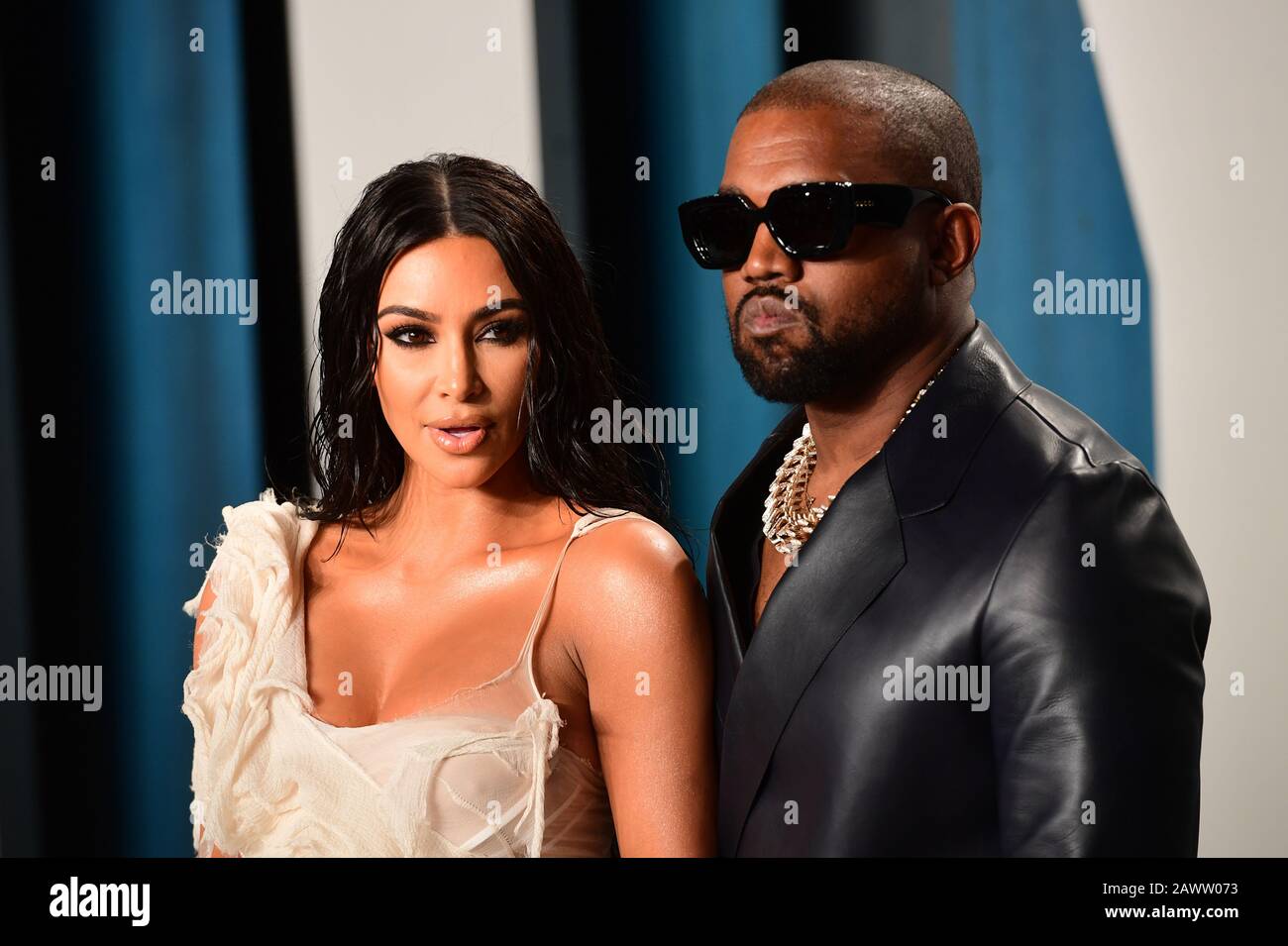Kim Kardashian and Kanye West attending the Vanity Fair Oscar Party ...