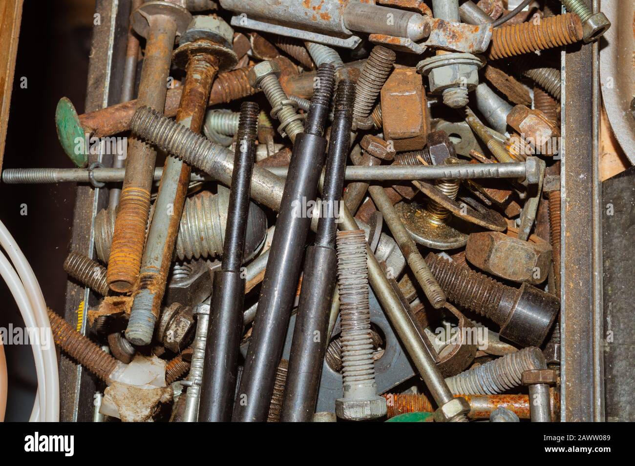 Pile of fasteners and screws close up. scrap metal. different metal ...