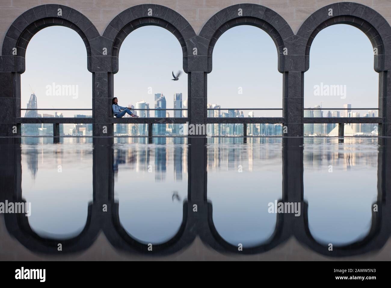 Arches reflected in the courtyard of the Museum of Islamic Art in Doha ...