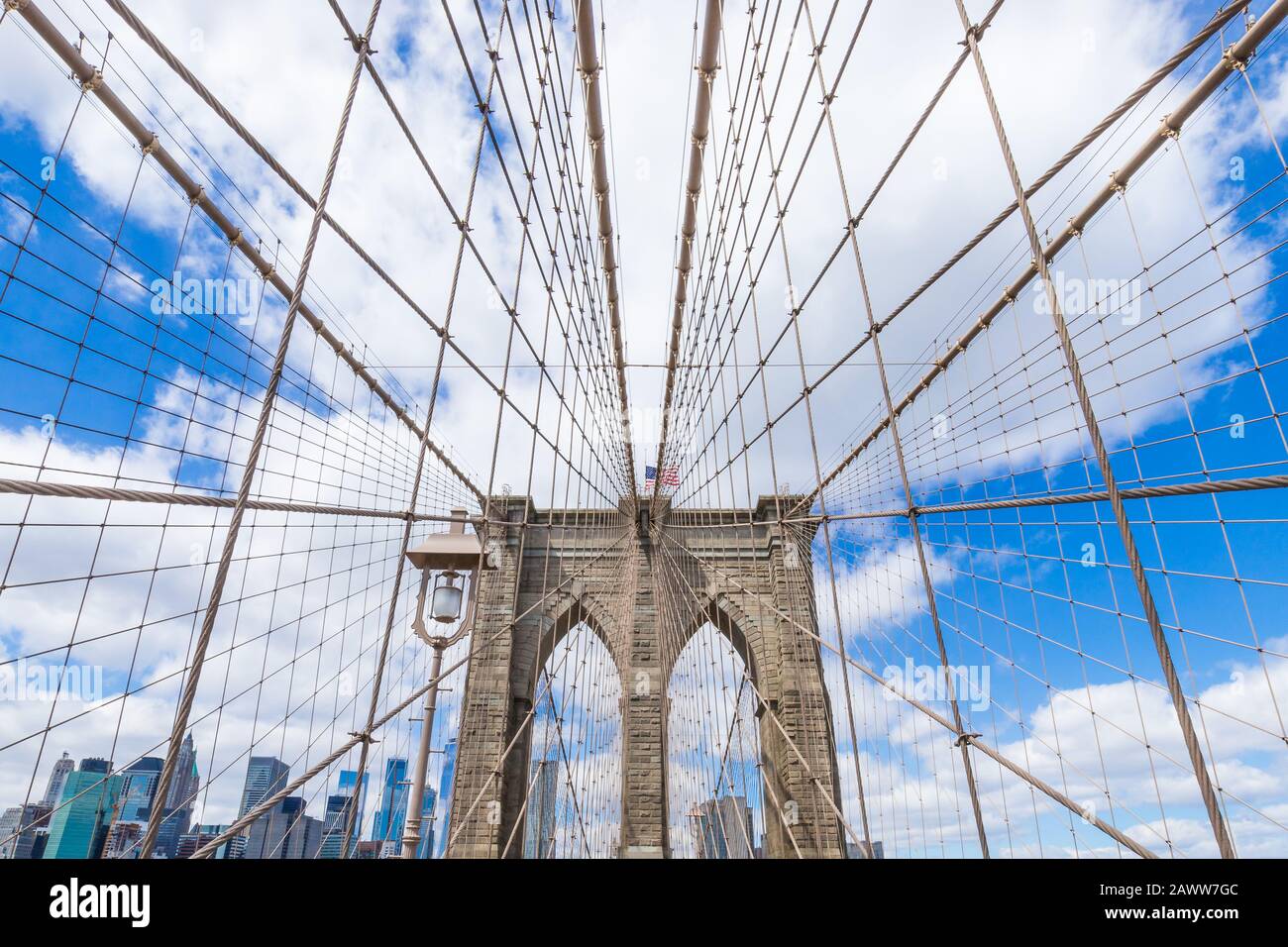 Brooklyn Bridge with Manhattan downtown and Cityscape on sunny day with ...