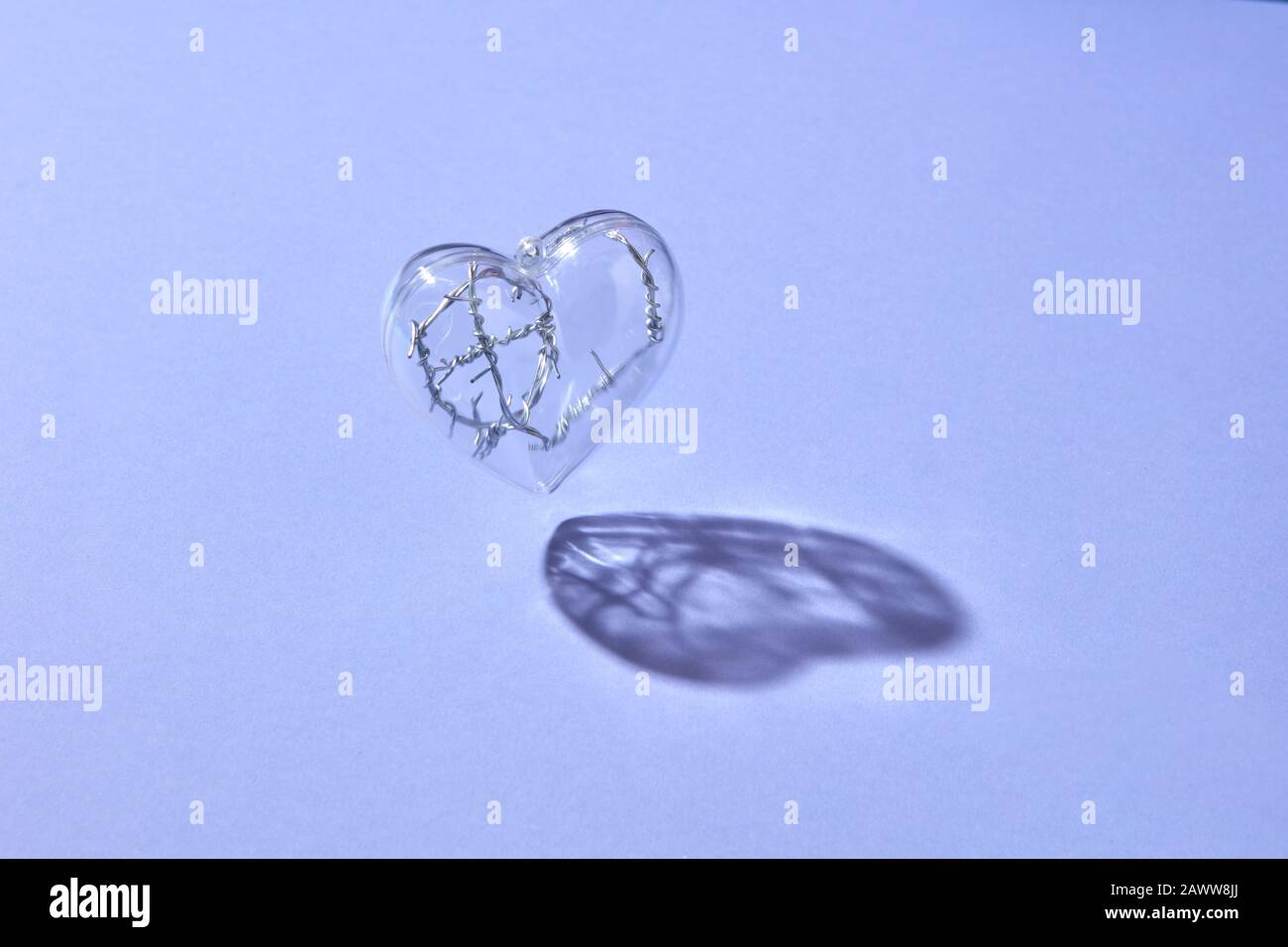 Floating clear heart with twisted wire inside Stock Photo - Alamy