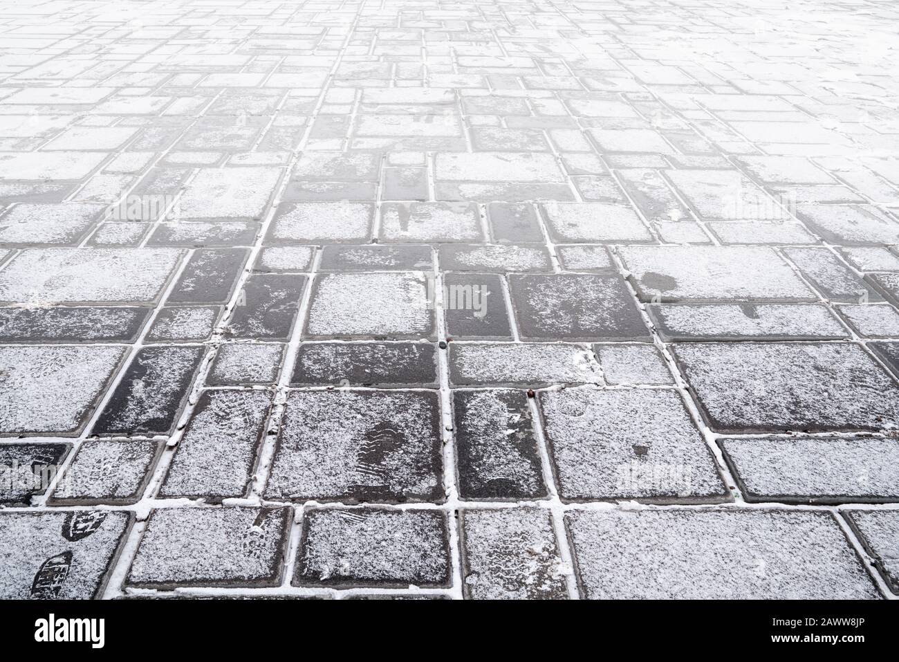 Grey granite stone walkway covered with snow. Pavement texture Stock ...