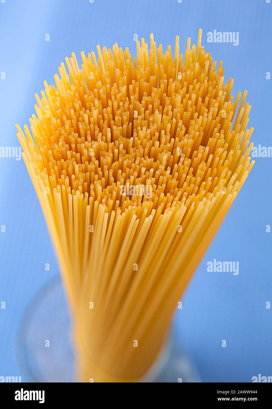 Long spaghetti on blue hi-res stock photography and images - Alamy