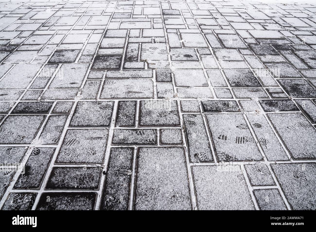 Grey granite stone walkway covered with snow. Pavement texture Stock ...