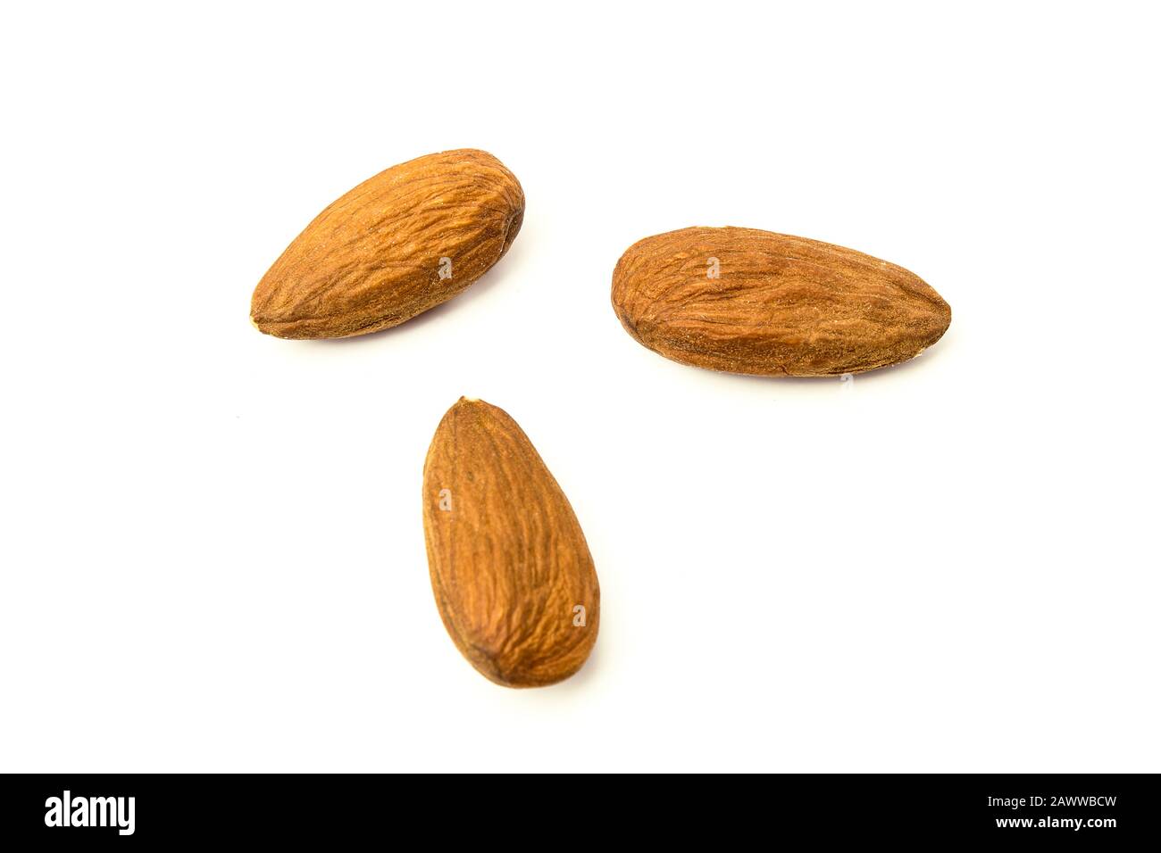 Purified almond kernels isolated on white Stock Photo - Alamy