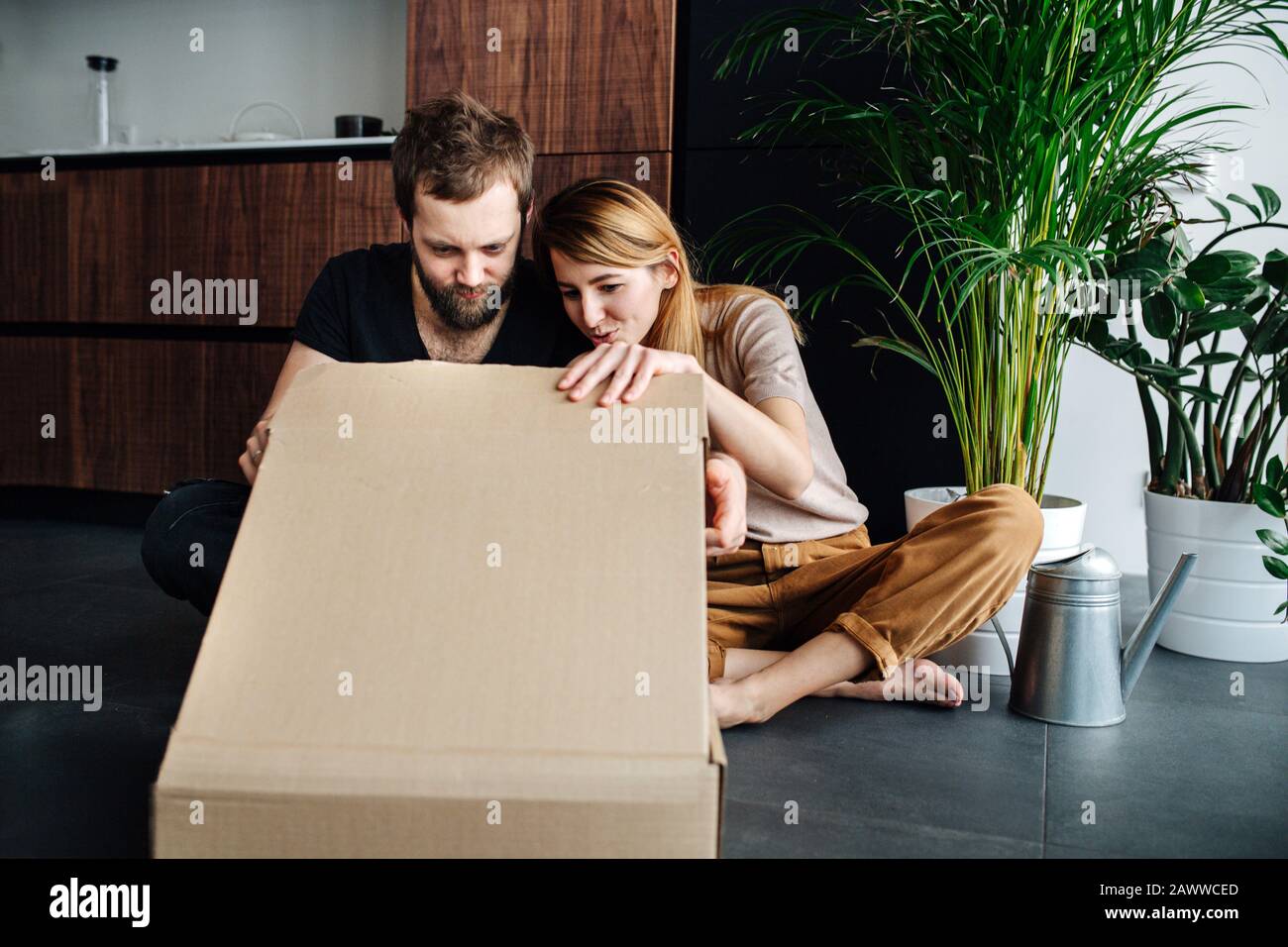 Man And Woman Sitting On A Box High Resolution Stock Photography and ...