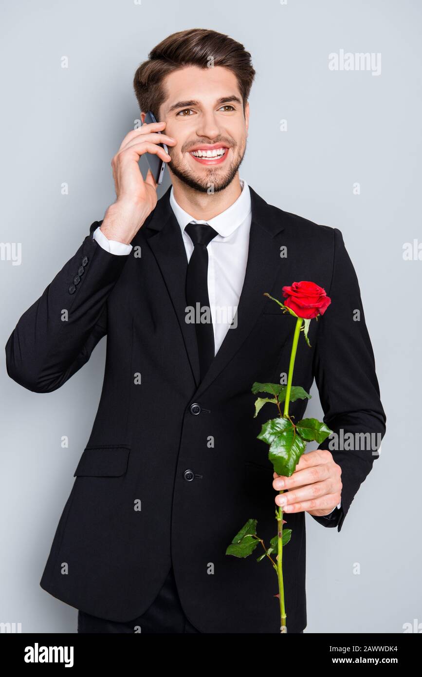 Young happy man with rose talking on phone with his girlfriend Stock ...