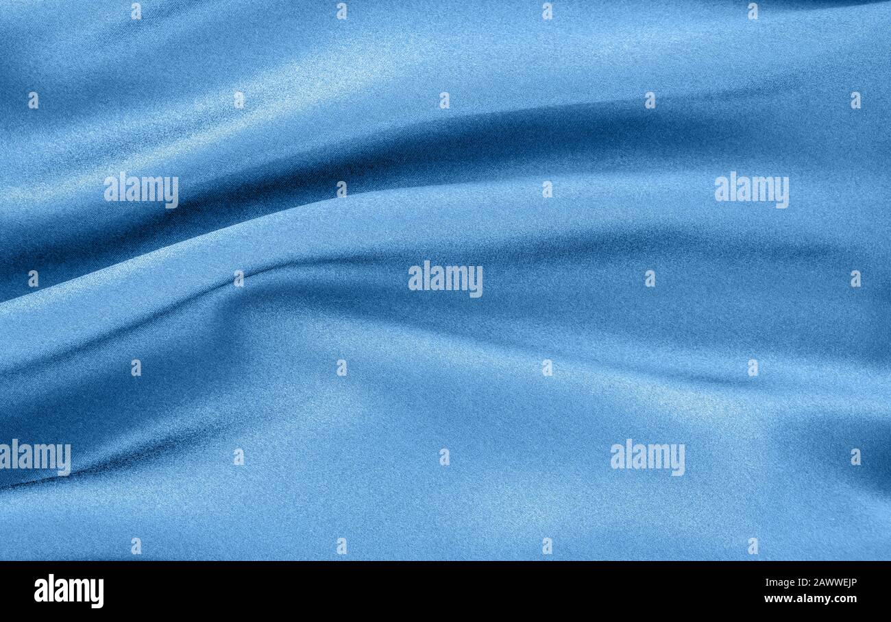 Blue natural silk fabric wavy drapery background. Top color trend of ...