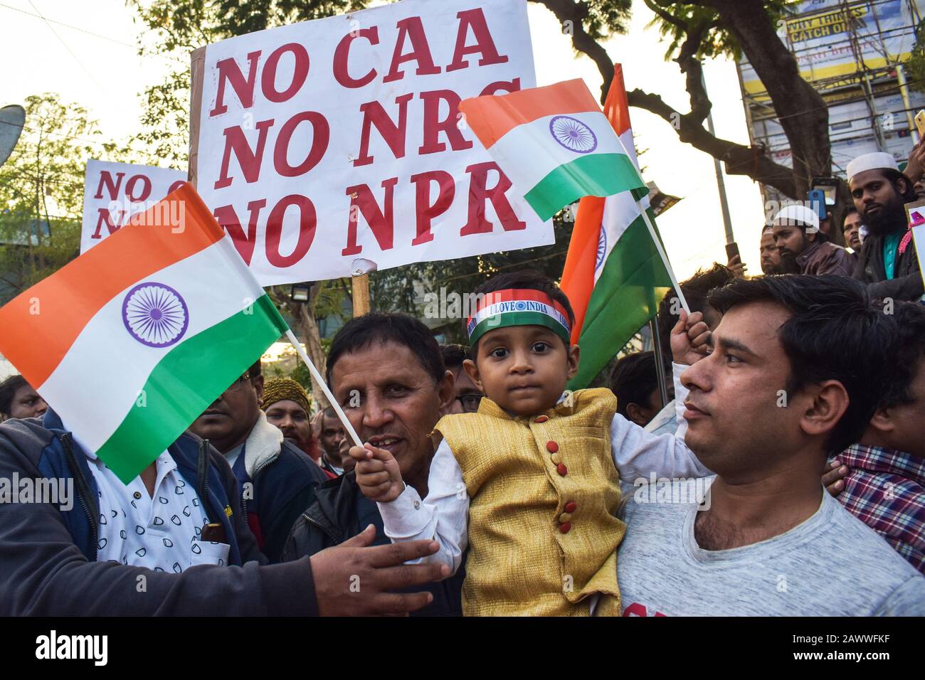 A little boy is showing the No NRC placard on a protest Program for NRC ...