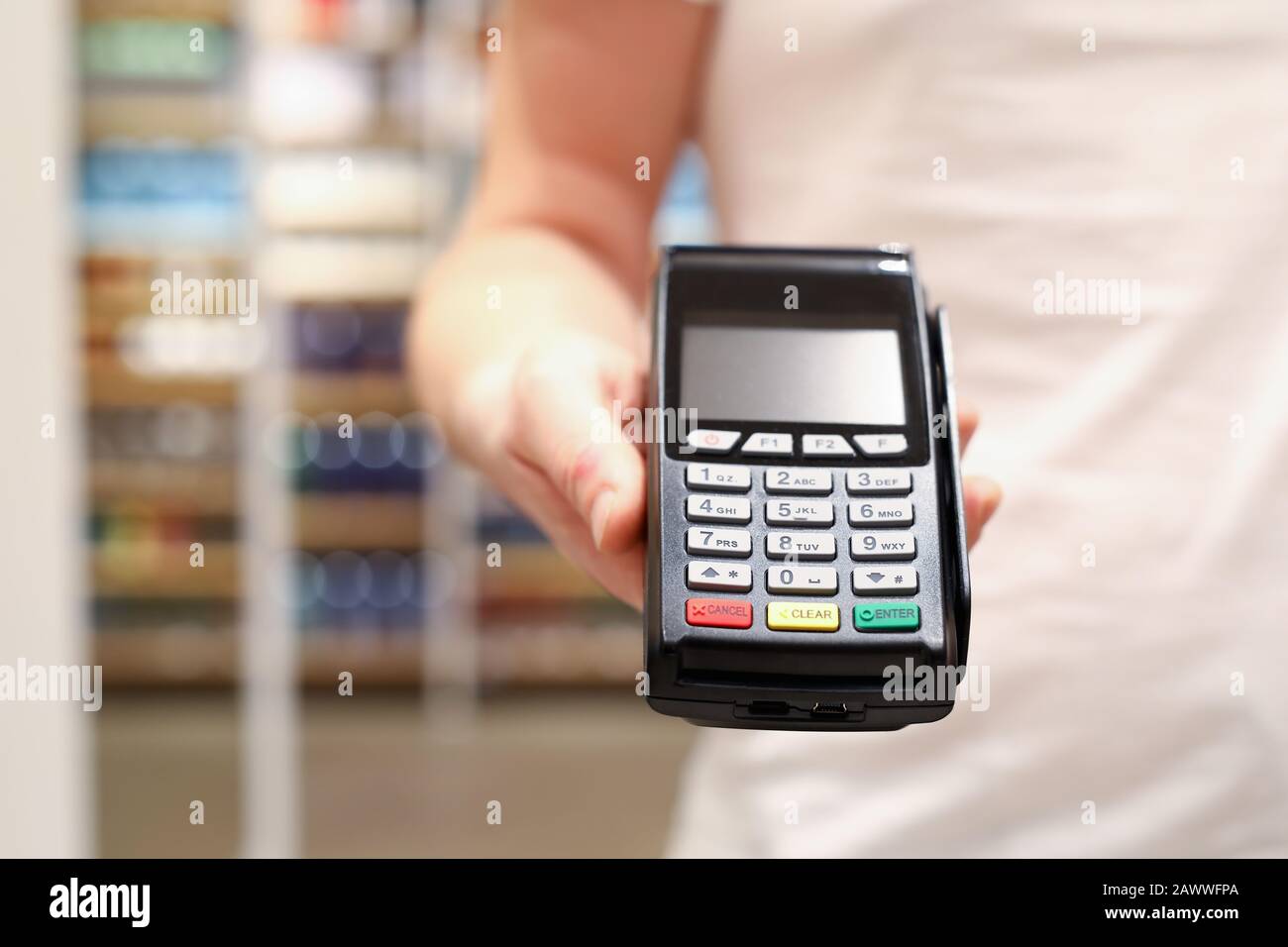 Male businessman hand hold POS terminal closeup Stock Photo - Alamy