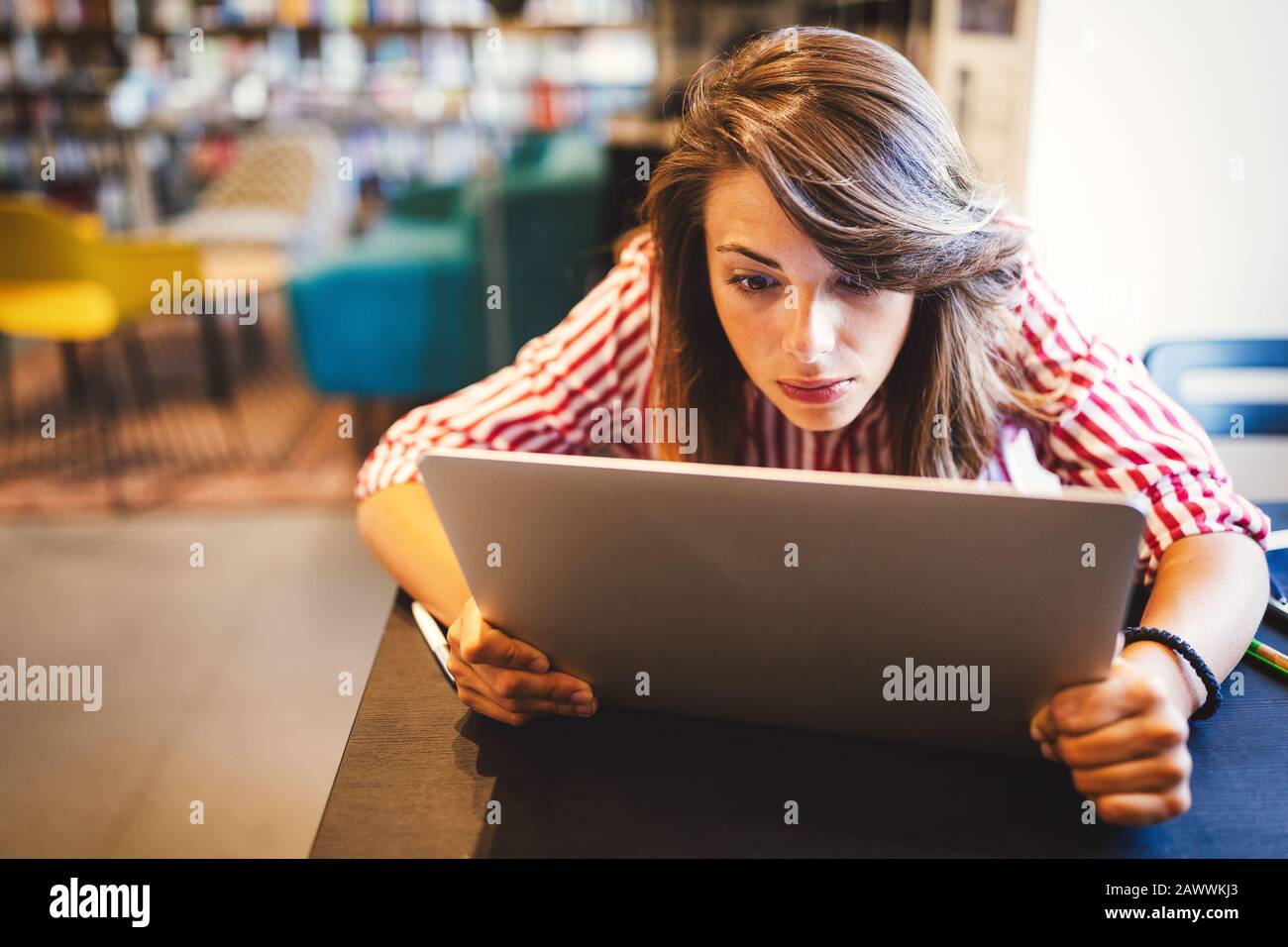 Student woman finding it difficult at study and comprehend scool tasks ...