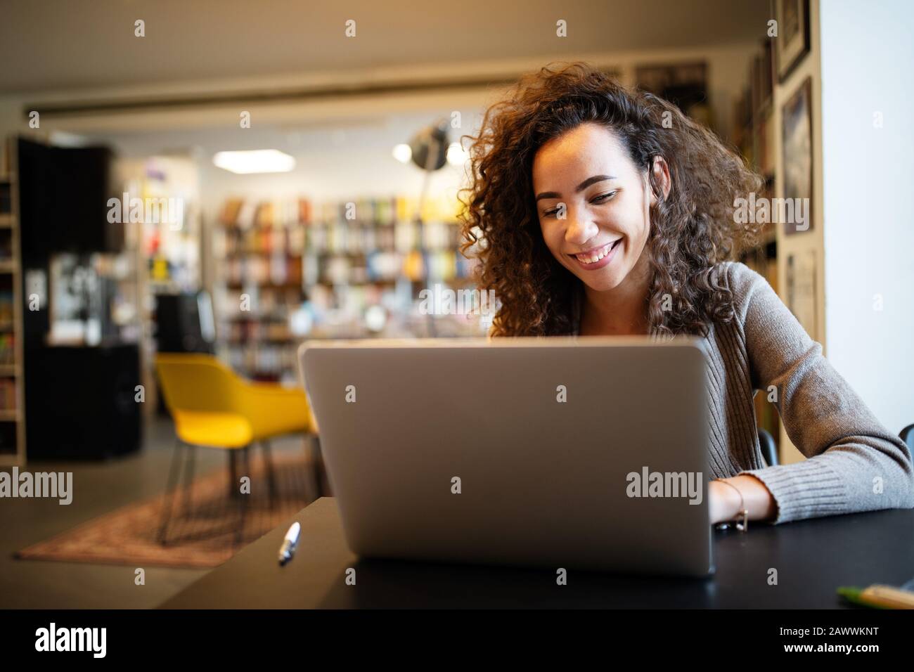 Young beautiful student girl working, learning in college library Stock ...