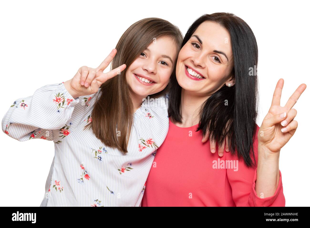 Beautiful young mother and her daughter making peace sign hand gesture ...