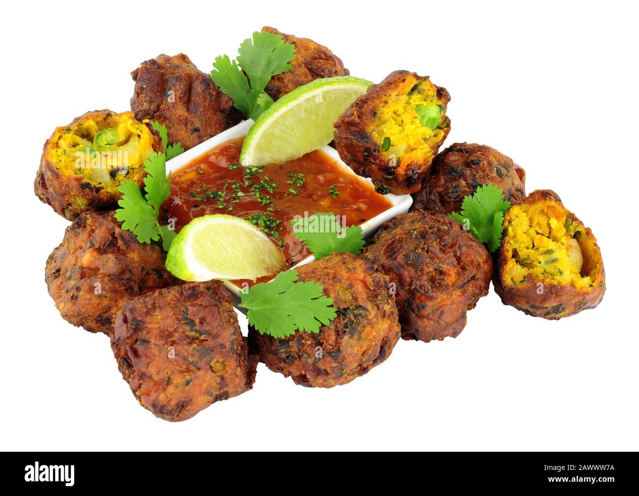 Group of fried vegetable pakora with chilli sauce dip isolated on a ...
