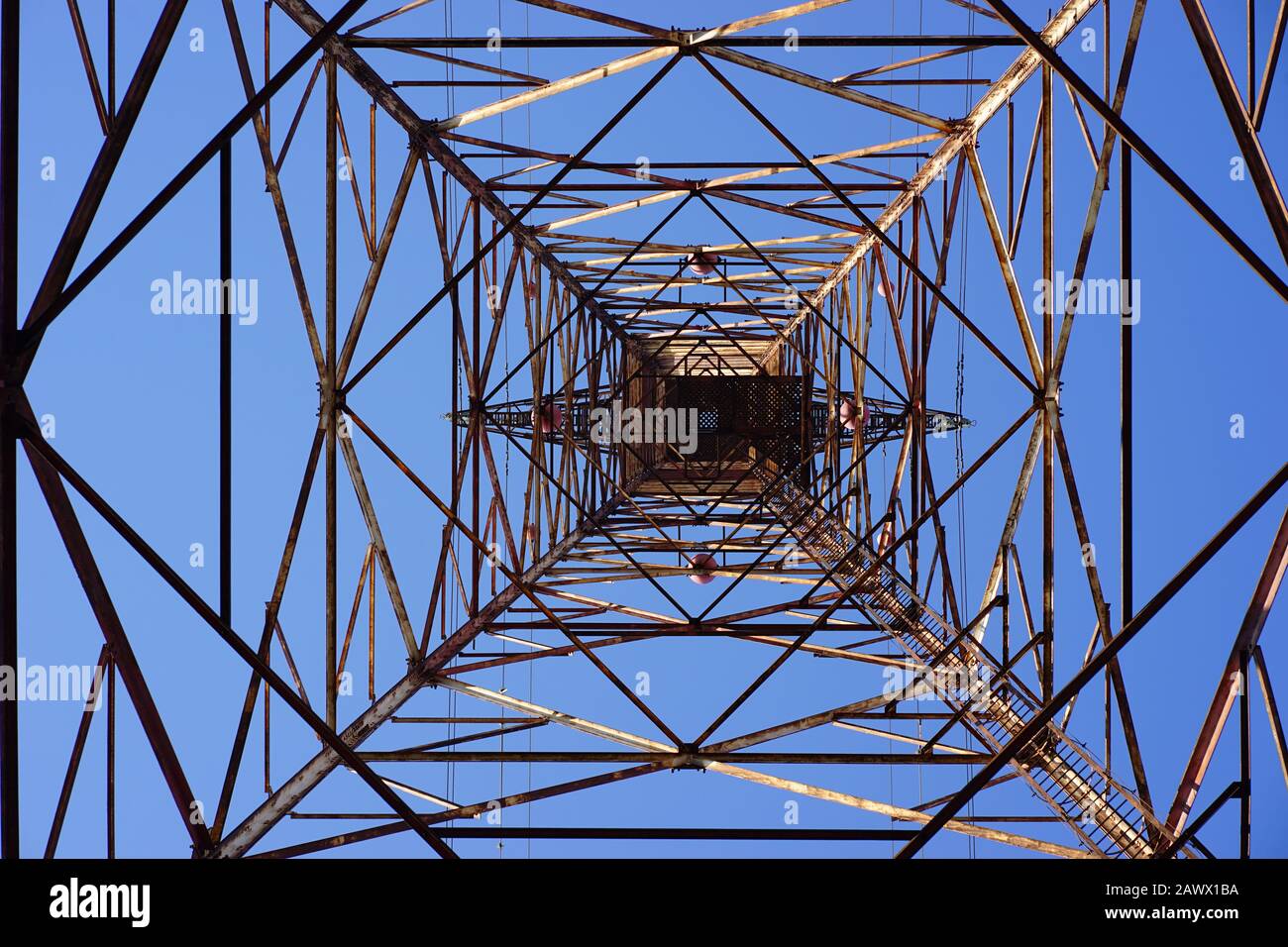 Electric pole with blue sky as background Stock Photo - Alamy